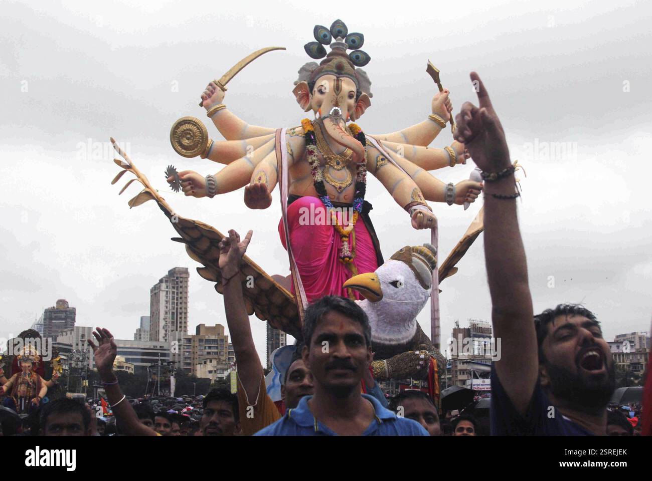 A gigantic idol of Hindu elephant-headed god Ganesh, being led to the ...