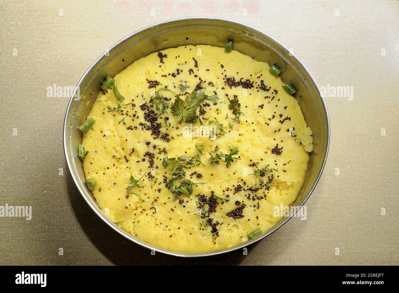 Food, khaman dhokla tadka mustard coriander green chilli in pot ...