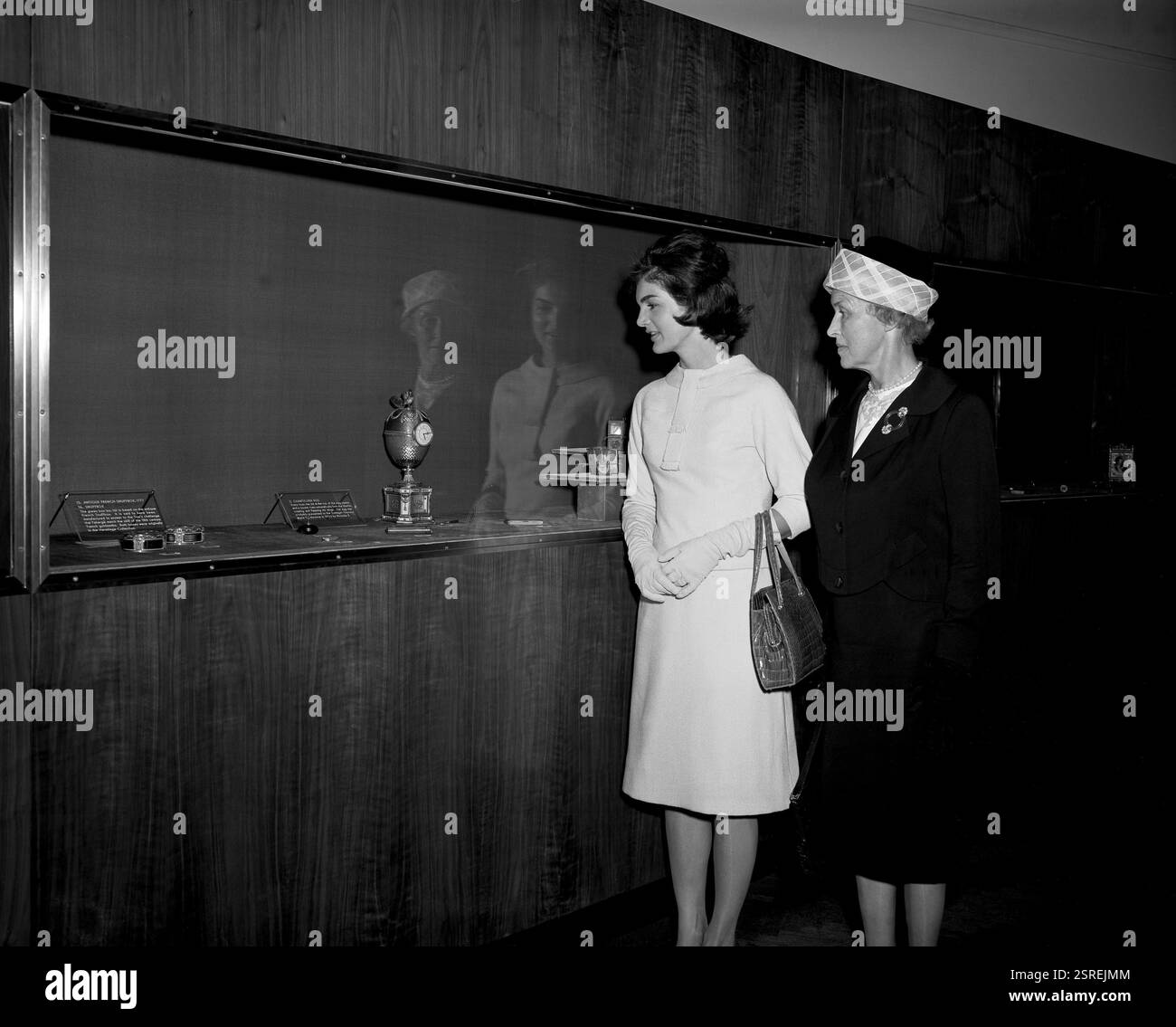 First Lady Jacqueline Kennedy looks at the Kelch Chanticleer egg made ...