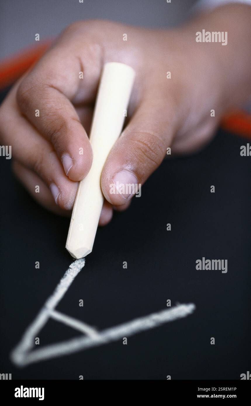 Hand writing a alphabet with chalk on slate MR#201 Stock Photo - Alamy