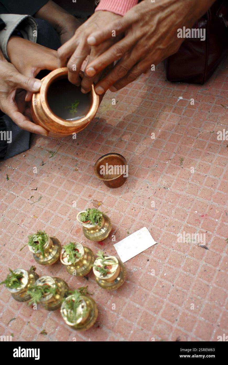 Devotees worship copper cans holy water can close-ups closeups Color ...