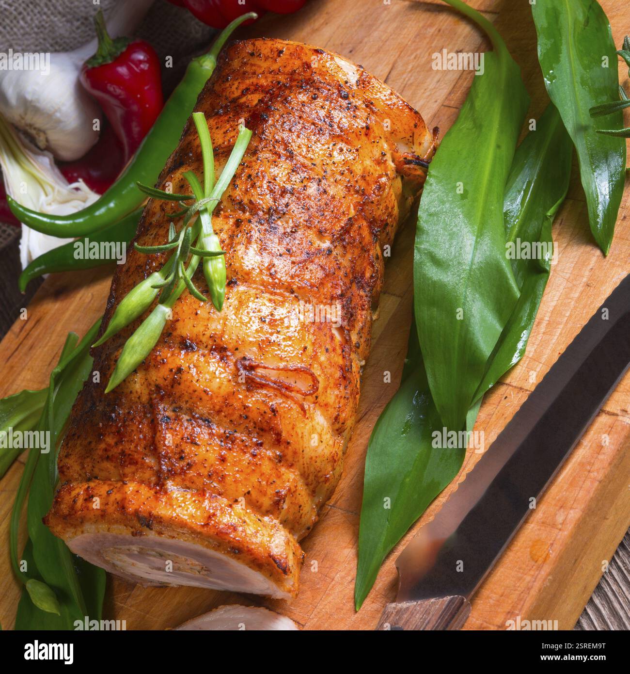 Meat roulade with bear allium filling Stock Photo - Alamy