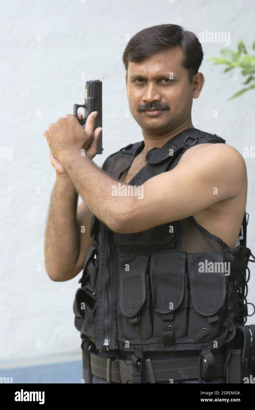 Black Cat commando with a revolver, Glock MR Stock Photo - Alamy