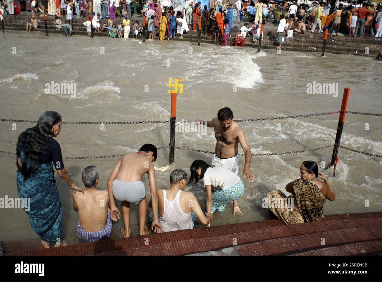 Devotees on riverbank ghats of river ganga ganges taking holy dip at ...
