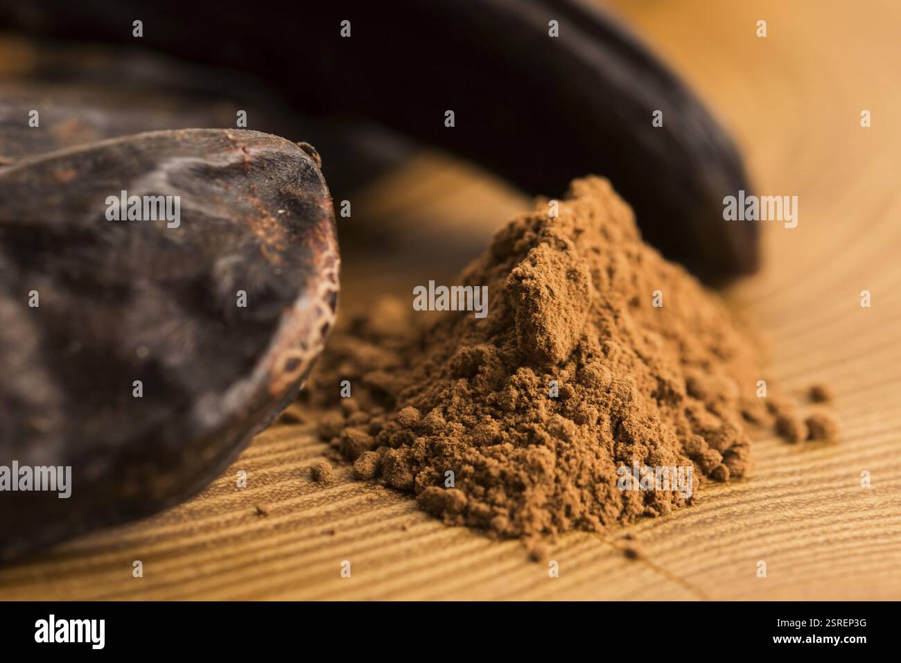 Carob pods and carob powder Stock Photo - Alamy