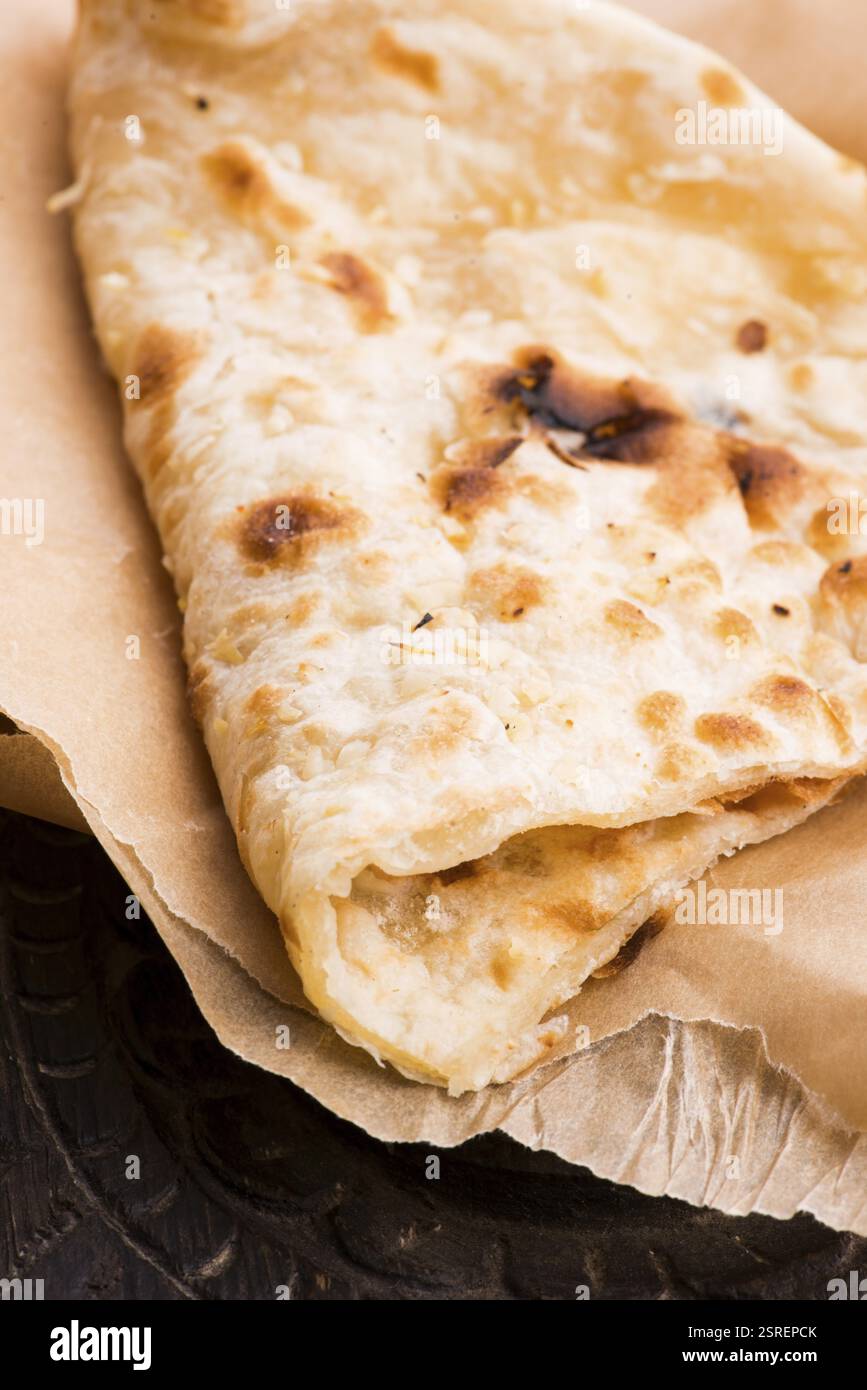 Garlic Naan, Indian flat bread Stock Photo - Alamy