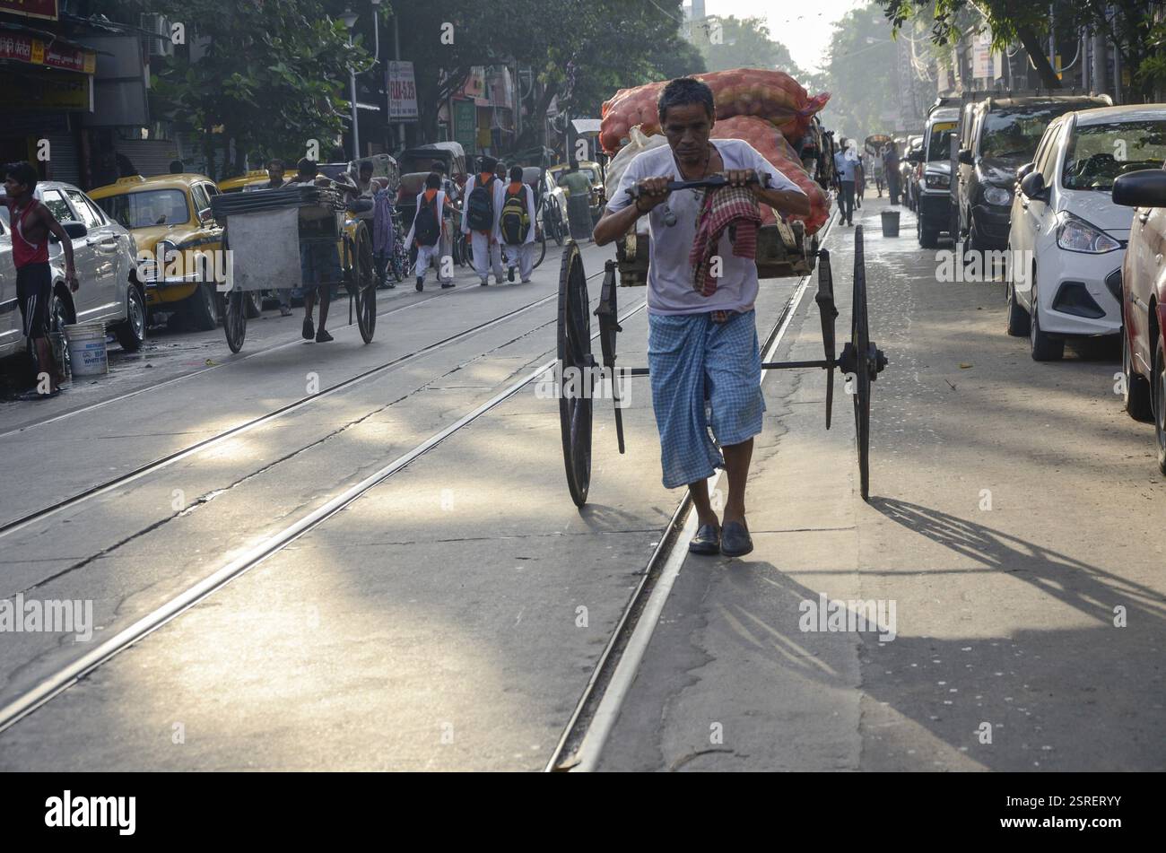 Man pulling rickshaw, Kolkata, West Bengal, India, Asia Stock Photo - Alamy