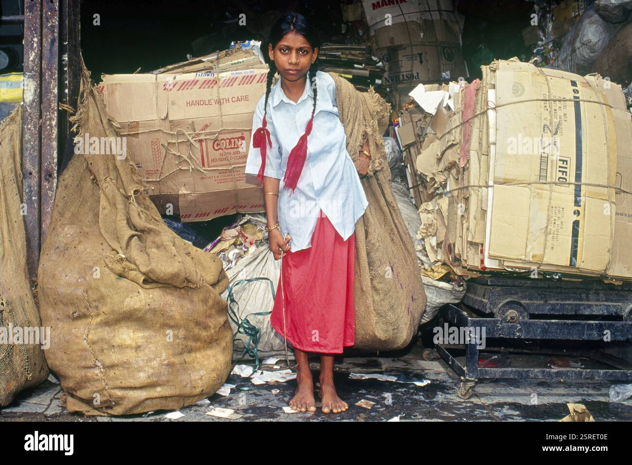 Rag picker girl with garbage collection bag on shoulder, Mumbai ...