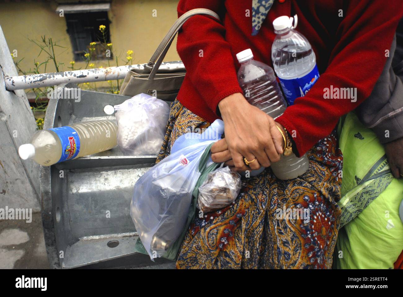 Devotee carry holy water bottle bottles close-ups closeups Color Colors ...