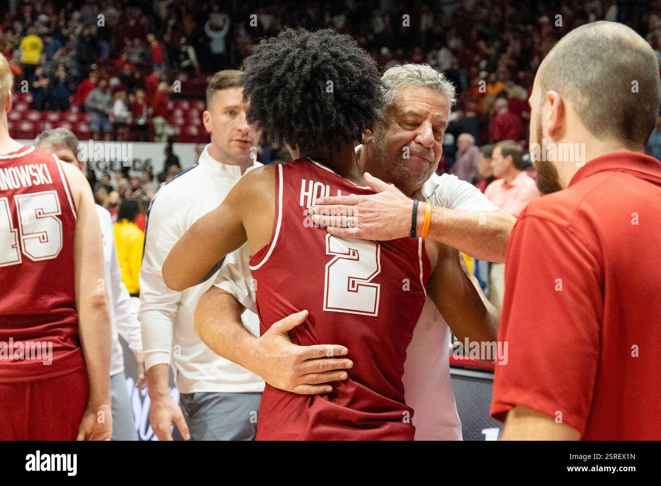 Auburn head coach Bruce Pearl hugs former Auburn player Aden Holloway ...