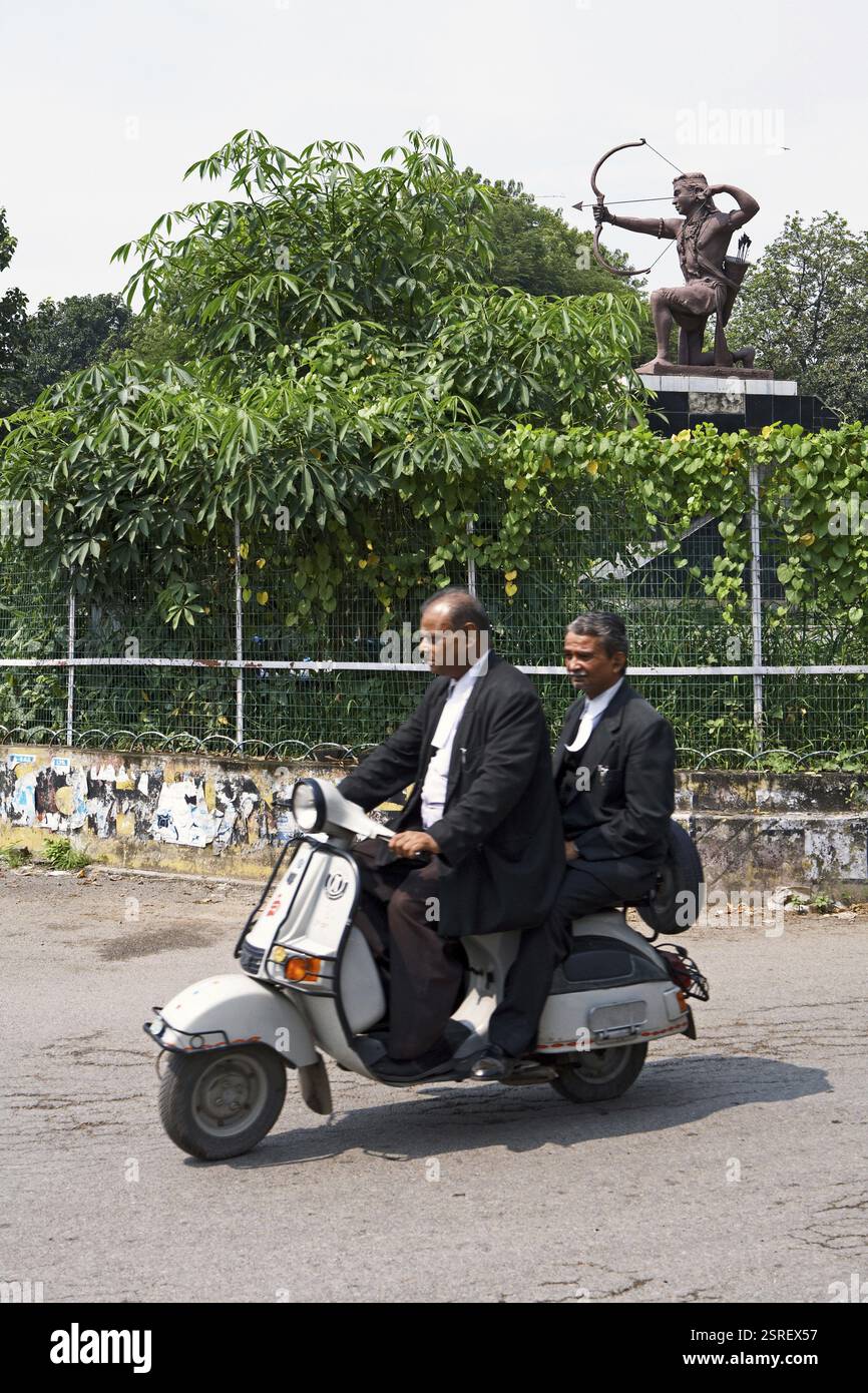 Lawyers on scooter below Statue of Eklavya, Uttar Pradesh, India, Asia ...