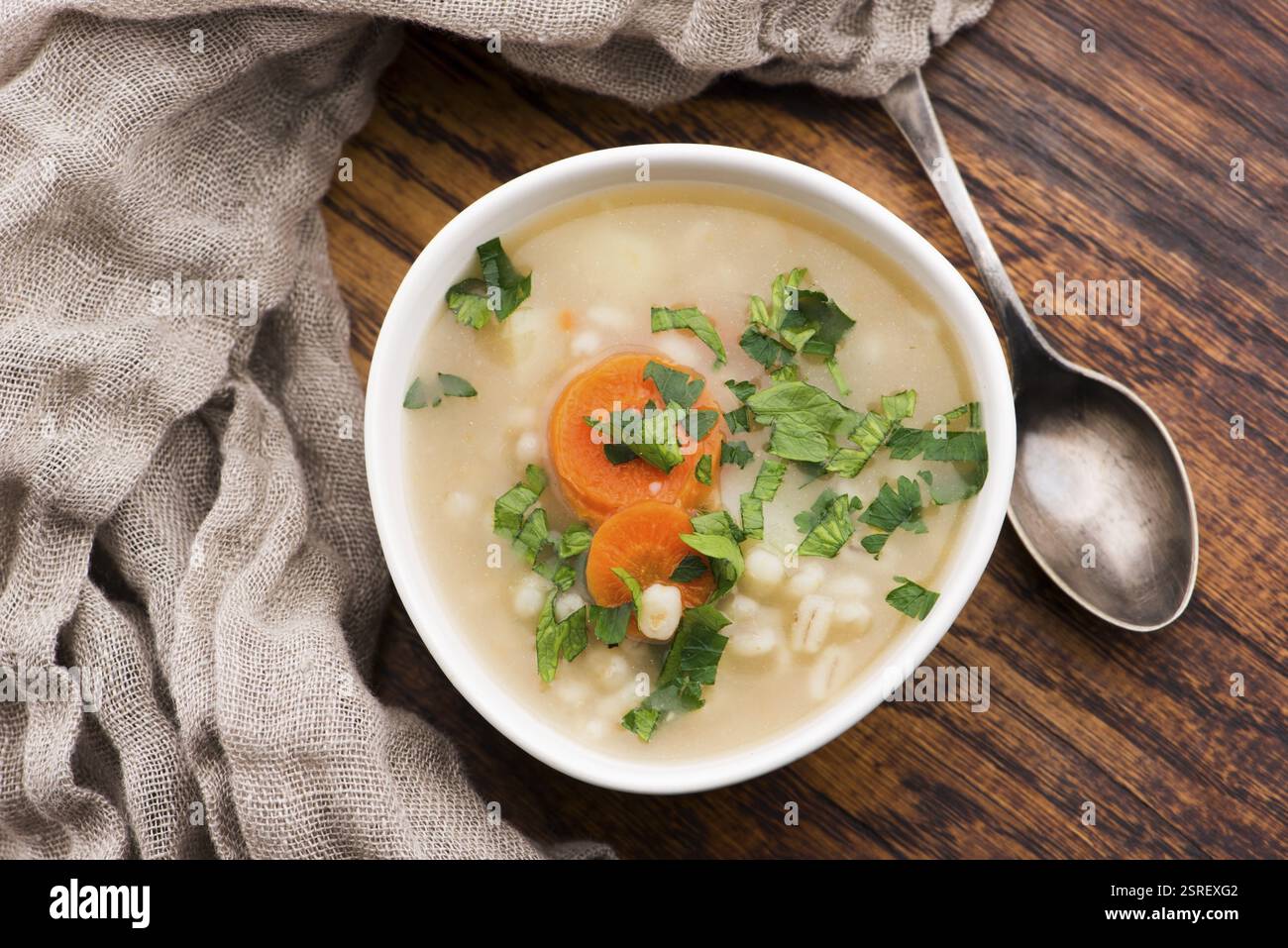 Barley soup, pearl barley in white bowl Stock Photo - Alamy