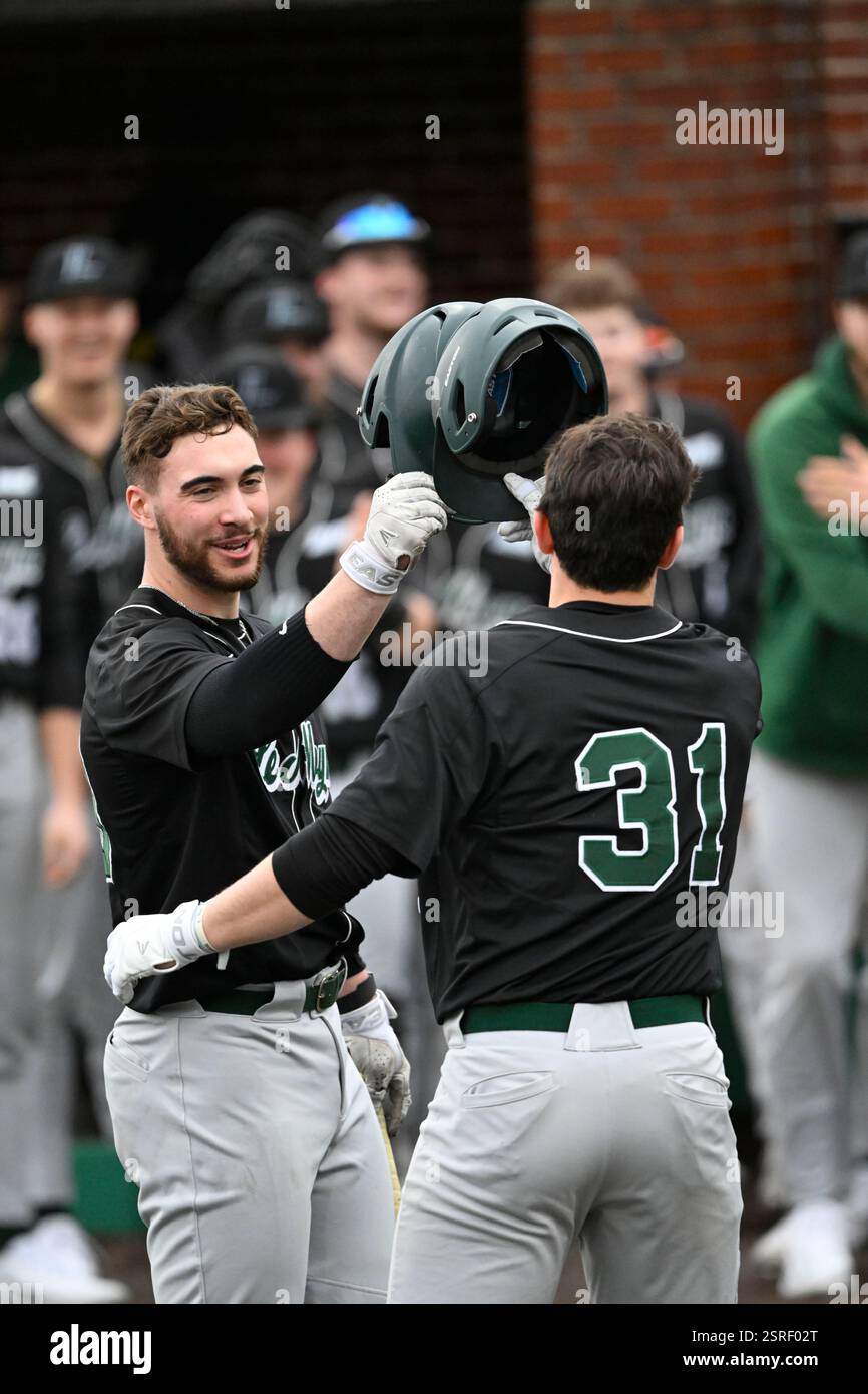 Le Moyne's Robert Wegrzyn congratulates Tim Denet at home plate after ...