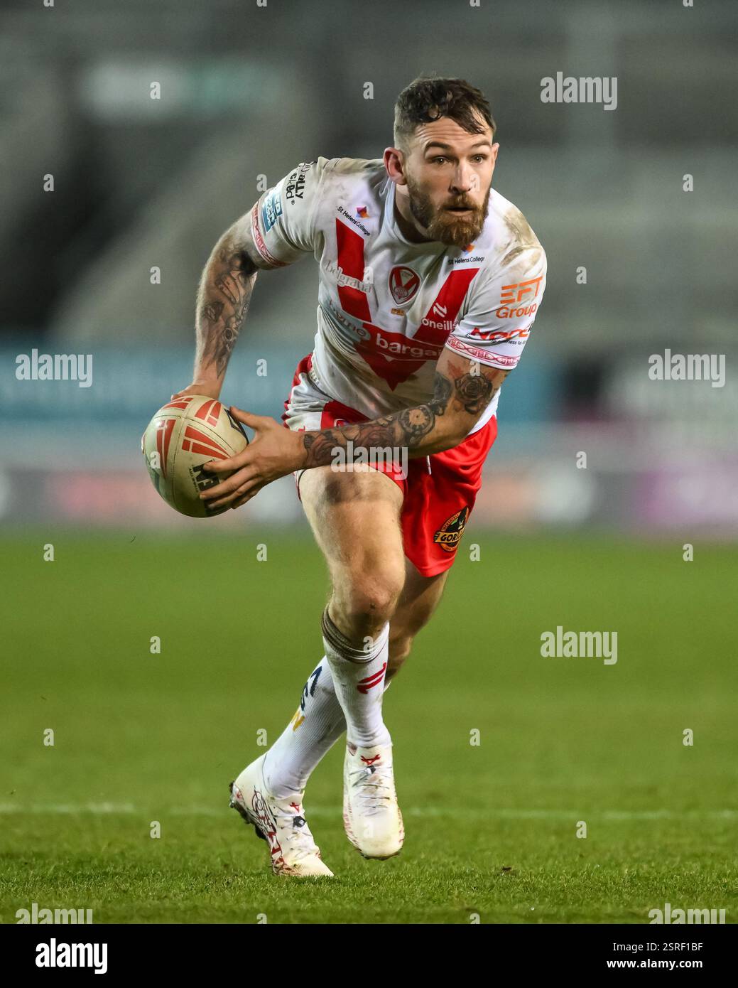 Daryl Clark of St. Helens makes a break during the Betfred Super League ...
