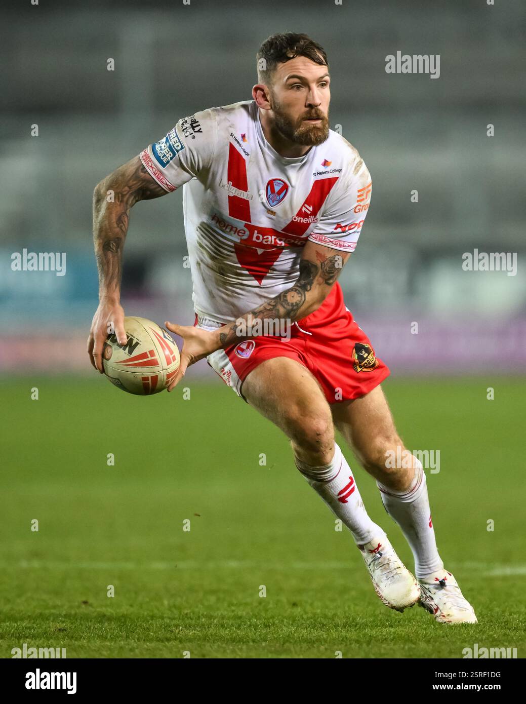 Daryl Clark of St. Helens makes a break during the Betfred Super League ...