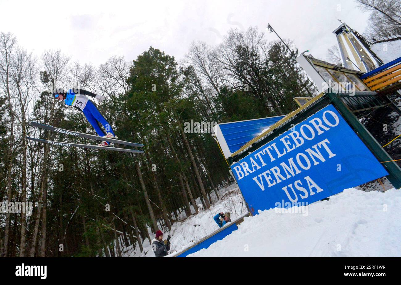 Miles Warnke, a member of the Steamboat team, goes off the inrun at the ...