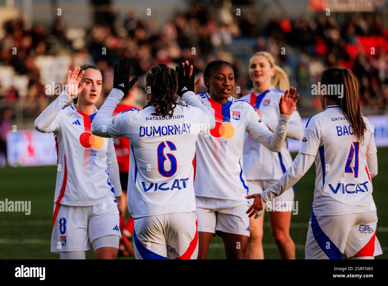 Lyon, France. 15th Feb, 2025. Melchie Dumornay (6 Olympique Lyonnais) and Players of Olympique ...
