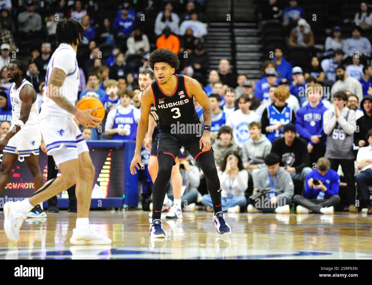 Newark, USA. 15th Feb, 2025. UConn's Jaylin Stewart (3) plays defense ...