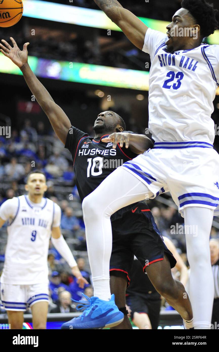 Newark, USA. 15th Feb, 2025. UConn's Hassan Diarra (10) goes for a ...