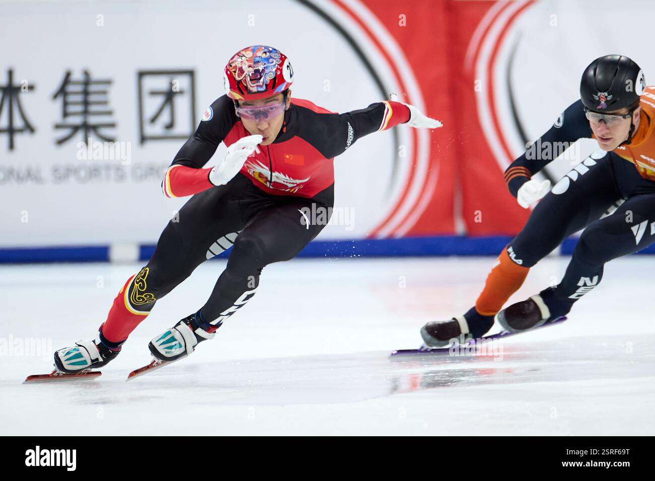 Milan, Italy. 15th Feb, 2025. Sun Long (L) of China competes during the ...