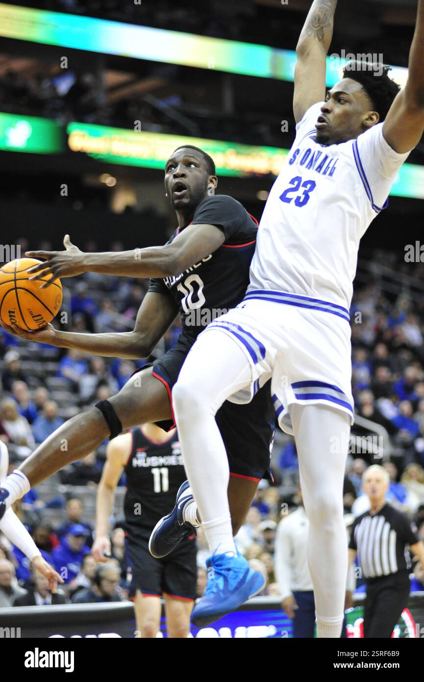Newark, USA. 15th Feb, 2025. UConn's Hassan Diarra (10) goes for a ...