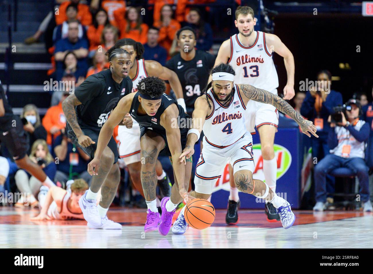 Michigan State's Jeremy Fears Jr. and Illinois' Kylan Boswell scramble ...