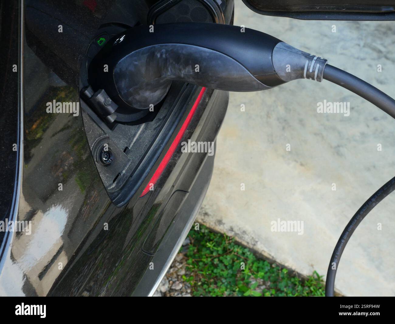 Power cable pump plug in charging power to black color electric vehicle ...