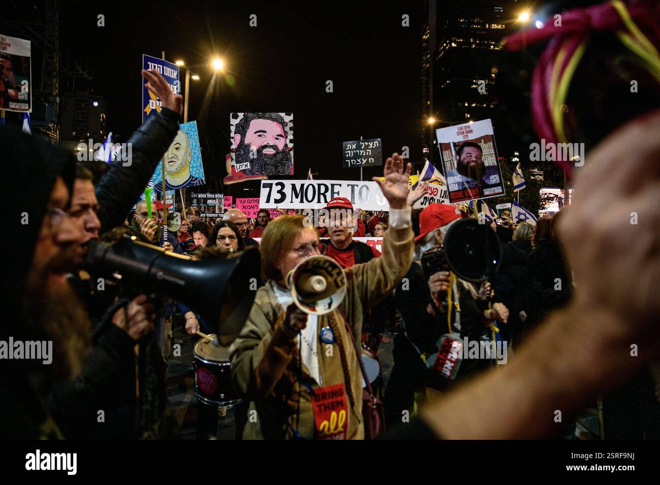 Tel Aviv, Israel. 15th Feb, 2025. Protestors chant to megaphones as ...