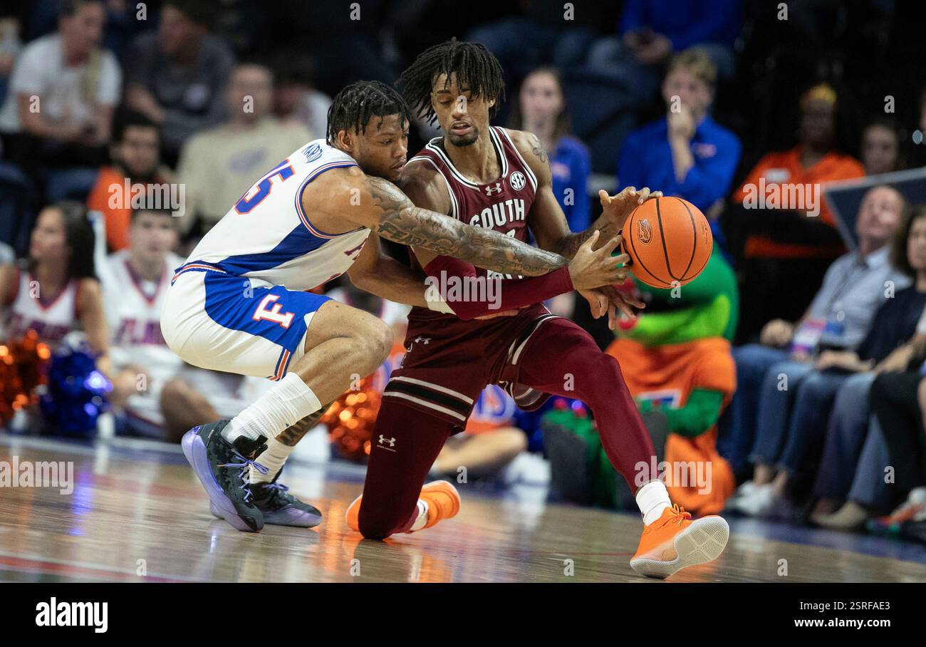 Florida guard Alijah Martin, left, pressures South Carolina guard Cam ...