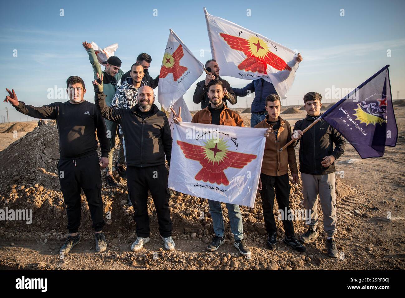 Hasaka, Syria. 15th Feb, 2025. Crowds welcome back a convoy of ...