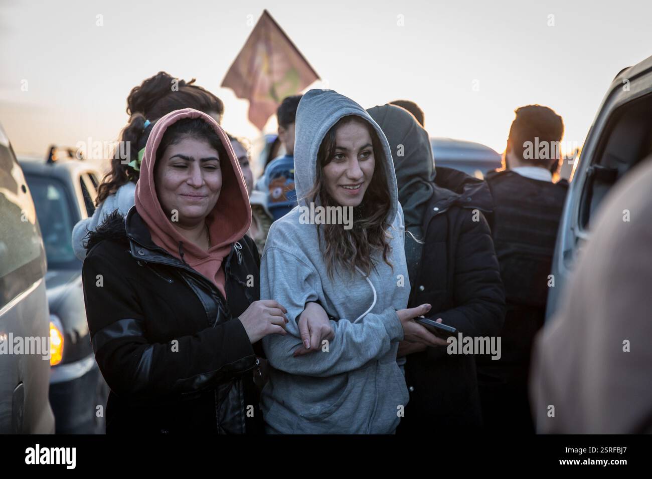Hasaka, Syria. 15th Feb, 2025. Friends and family members welcome back civilians who travelled ...