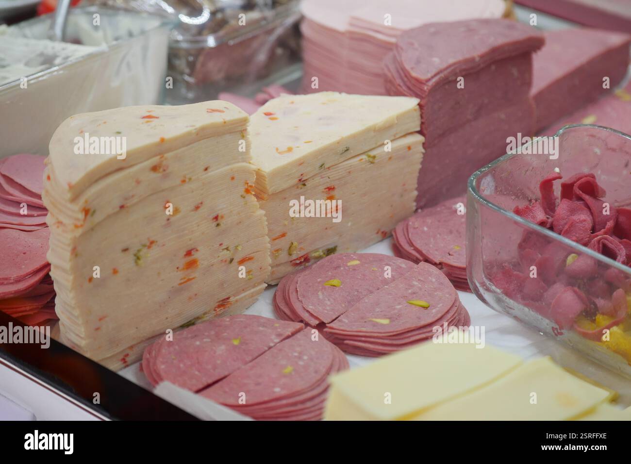 Deli counter display with assorted lunch meats and cheeses Stock Photo ...