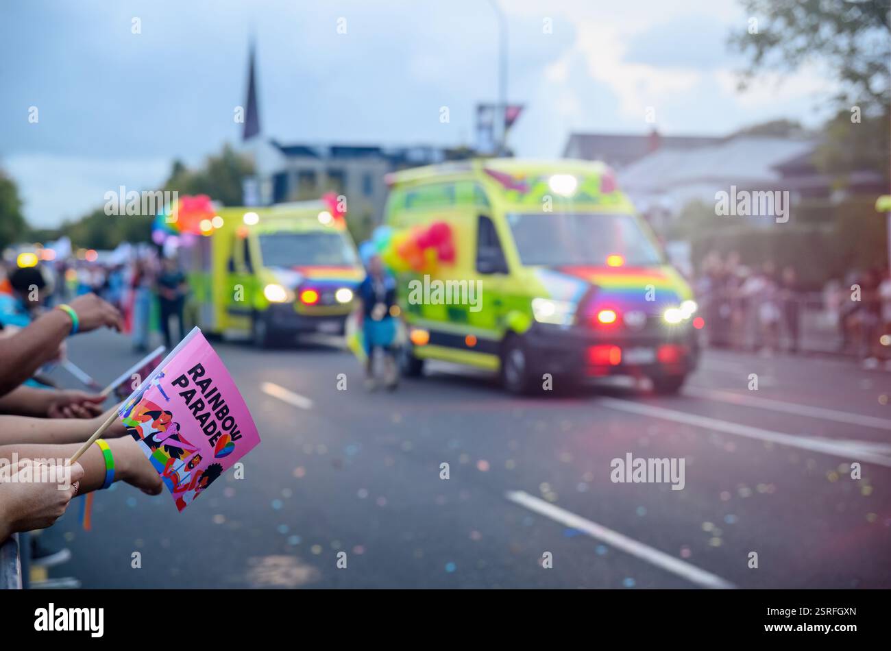 Auckland, New Zealand - Feb 15 2025: Crowd holding rainbow flags. Out ...