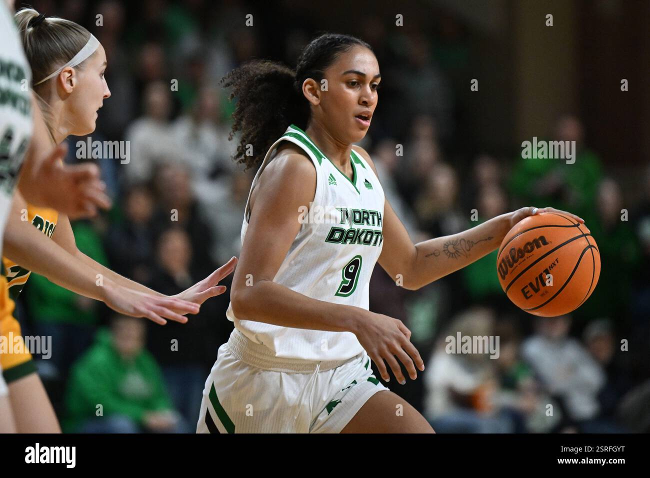 North Dakota Fighting Hawks forward Kiera Pemberton (9) drives with the ...