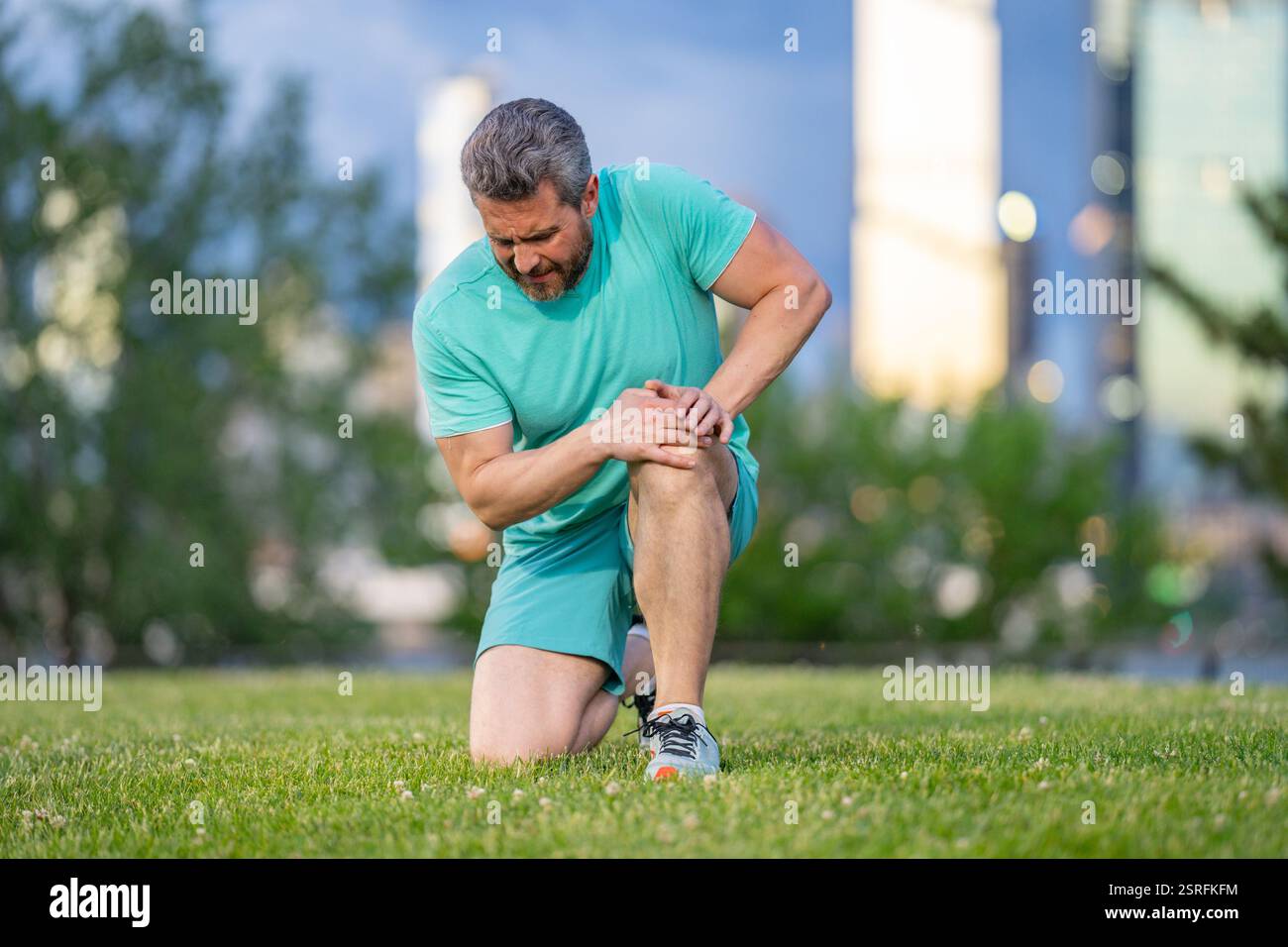 Knee after sport. Athletic man suffering from knee pain. Injured man ...