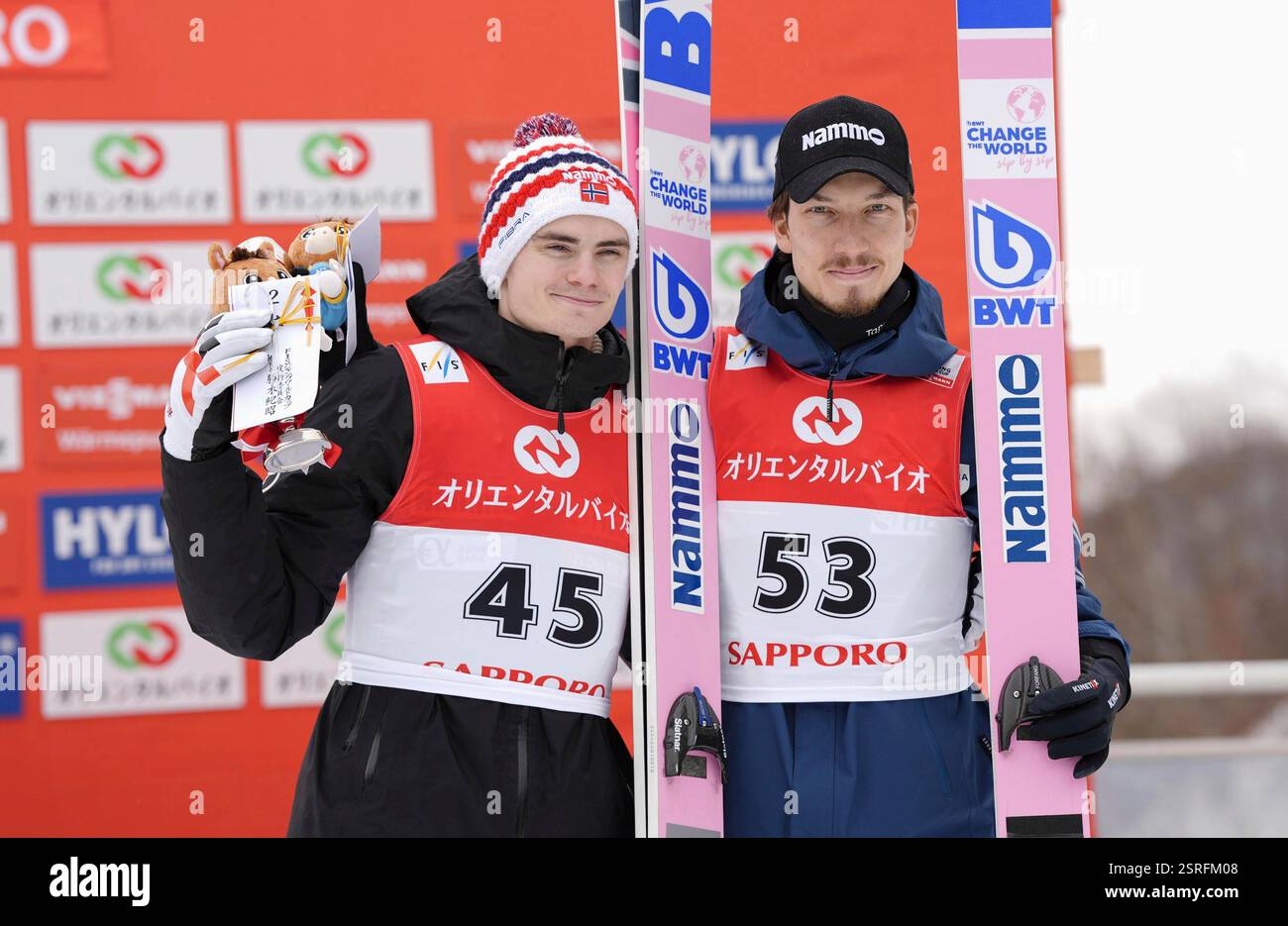 Second placed Marius Lindvik, left, of Norway, and third placed Johann ...