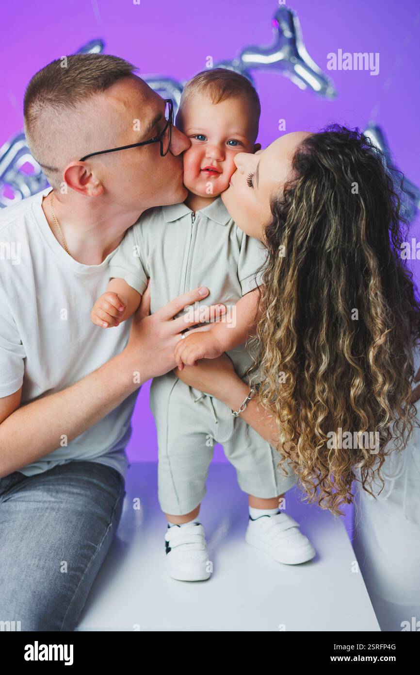 A joyful family portrait showcasing loving parents happily kissing ...