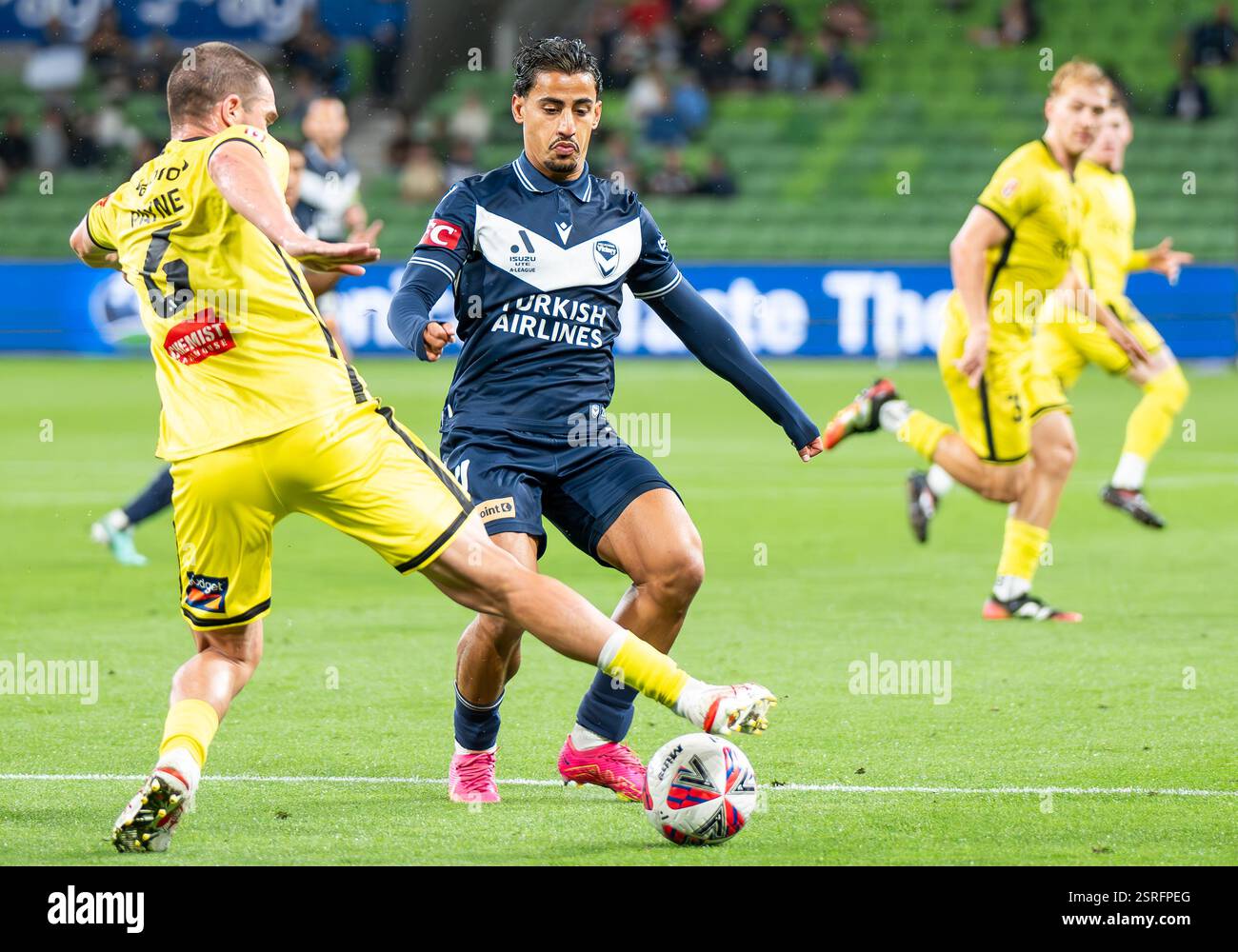 Melbourne, Australia. 14th Feb, 2025. Melbourne Victory's Daniel Arzani (R) and Wellington ...