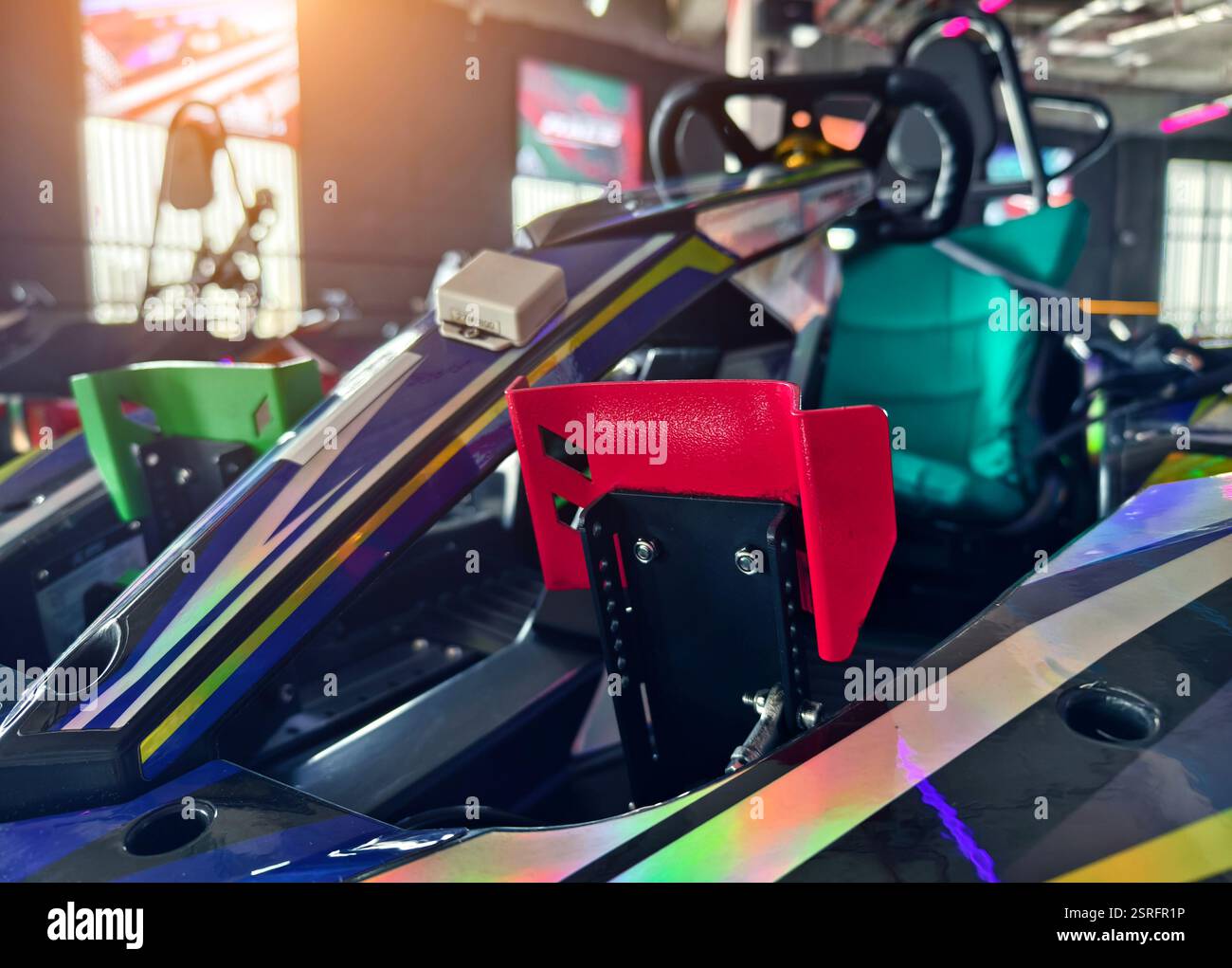 New electric go karts in the modern indoor racing track Stock Photo - Alamy