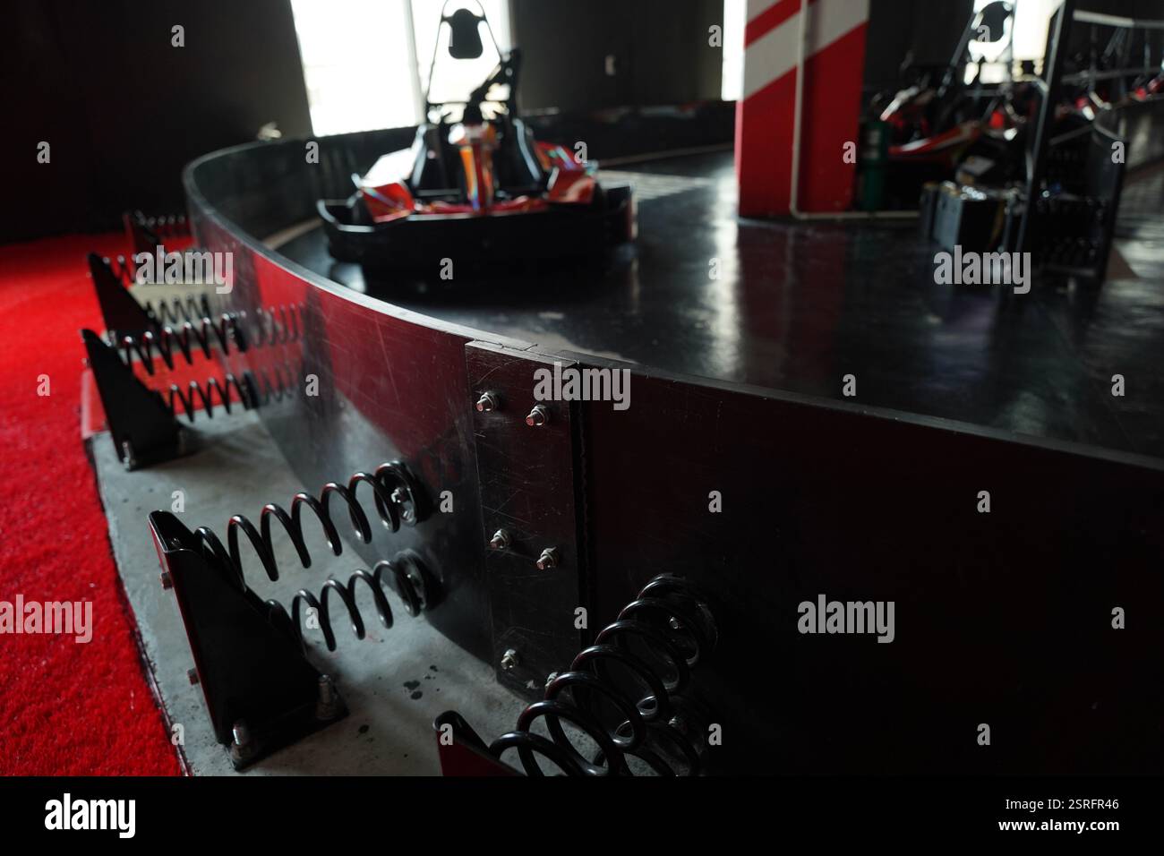 Details of modern indoor go kart racing track Stock Photo - Alamy