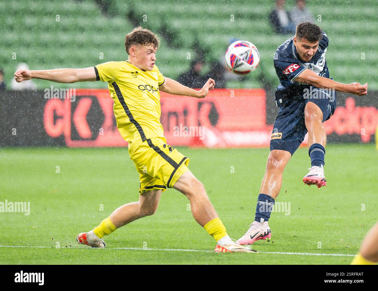 Melbourne, Australia. 14th Feb, 2025. Melbourne Victory's Zinédine Machach (R) and Wellington ...