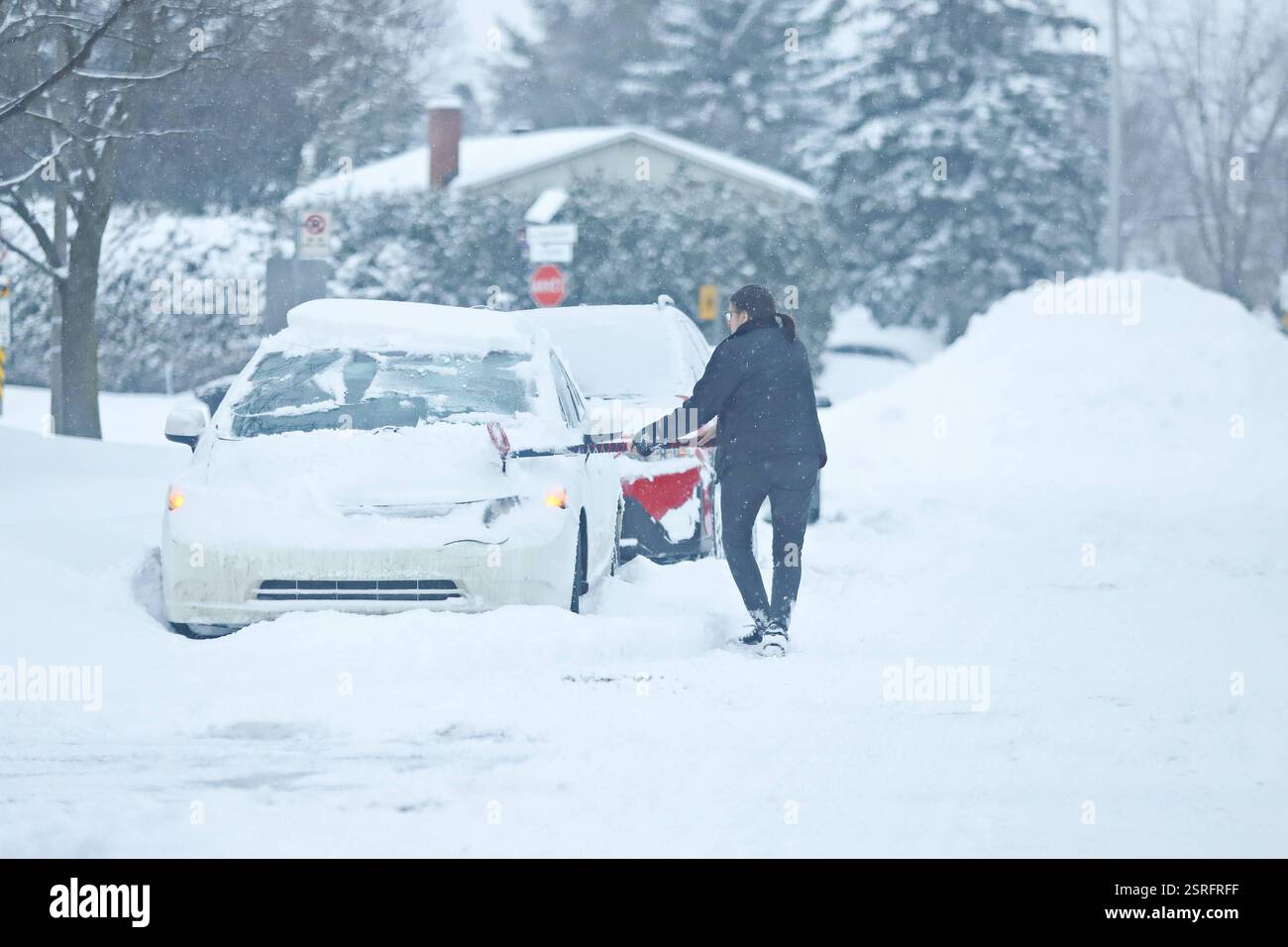 Montreal Under The Snow Due The Winter Depression A person clears his ...