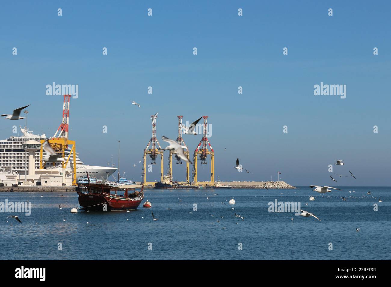 Sultan Qaboos Port - Muscat. A fishing boat and MSC Orchestra cruise ...