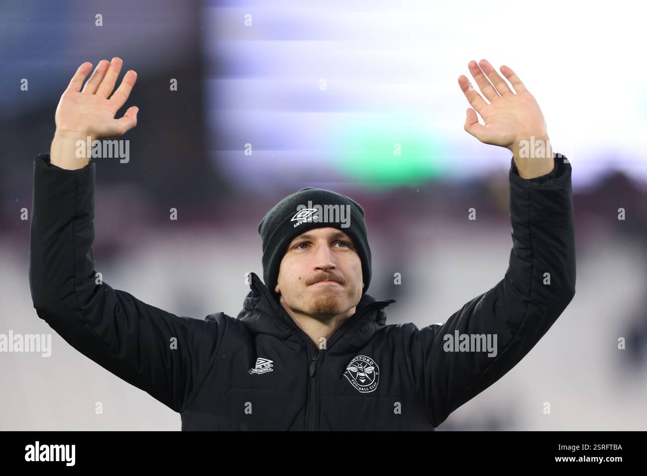 London, UK. 15th Feb, 2025. Vitaly Janelt (B) applauds the fans at the ...