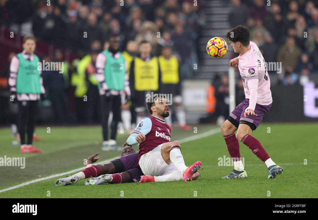 London, UK. 15th Feb, 2025. Yoane Wissa (B) Lucas Paqueta (WHU ...