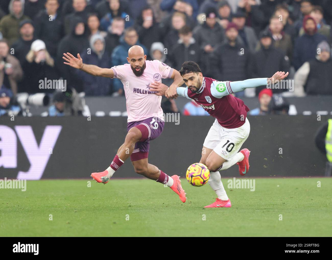 London, UK. 15th Feb, 2025. Bryan Mbeumo (B) Lucas Paqueta (WHU) at the ...
