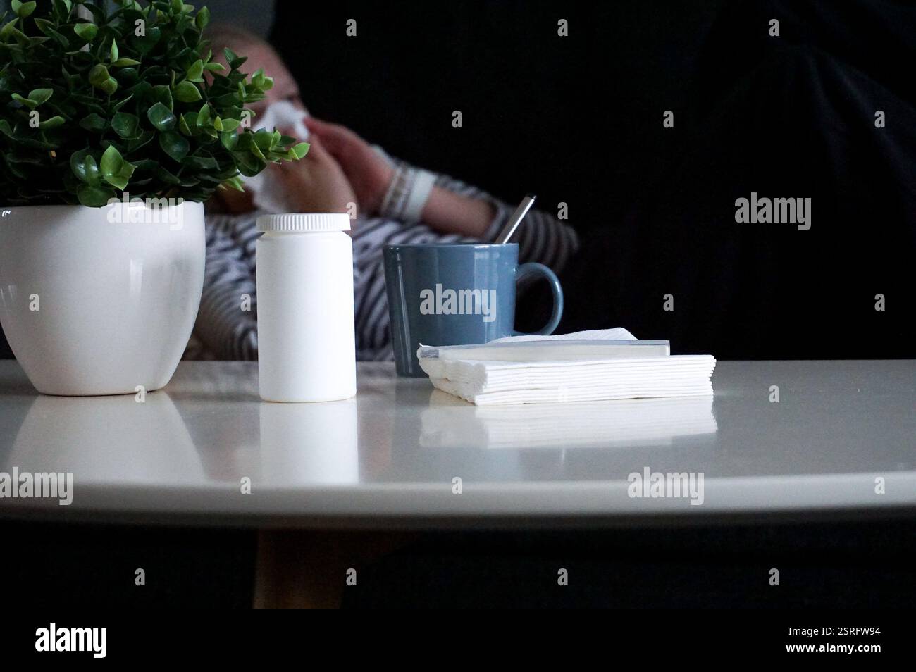 Person being sick and laying on the sofa Stock Photo - Alamy