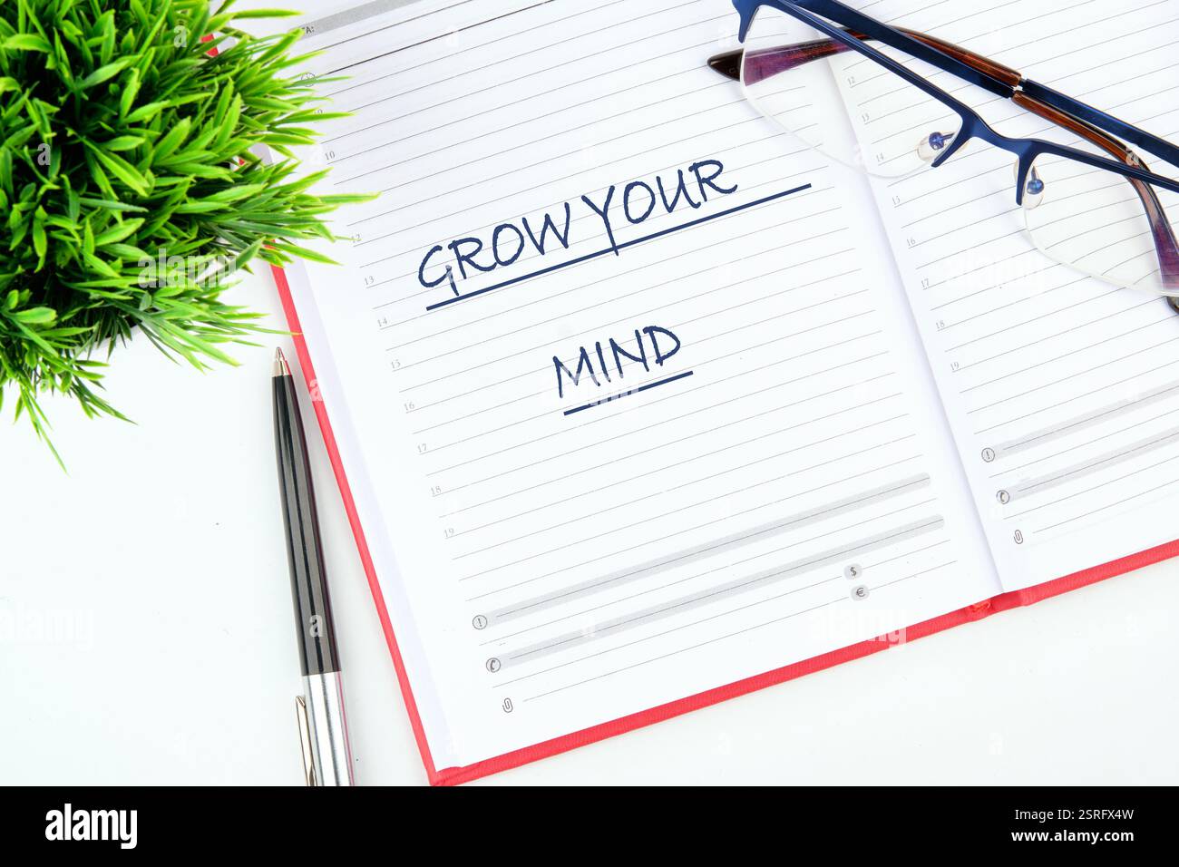 A well-organized notebook displays the phrase Grow Your Mind ...