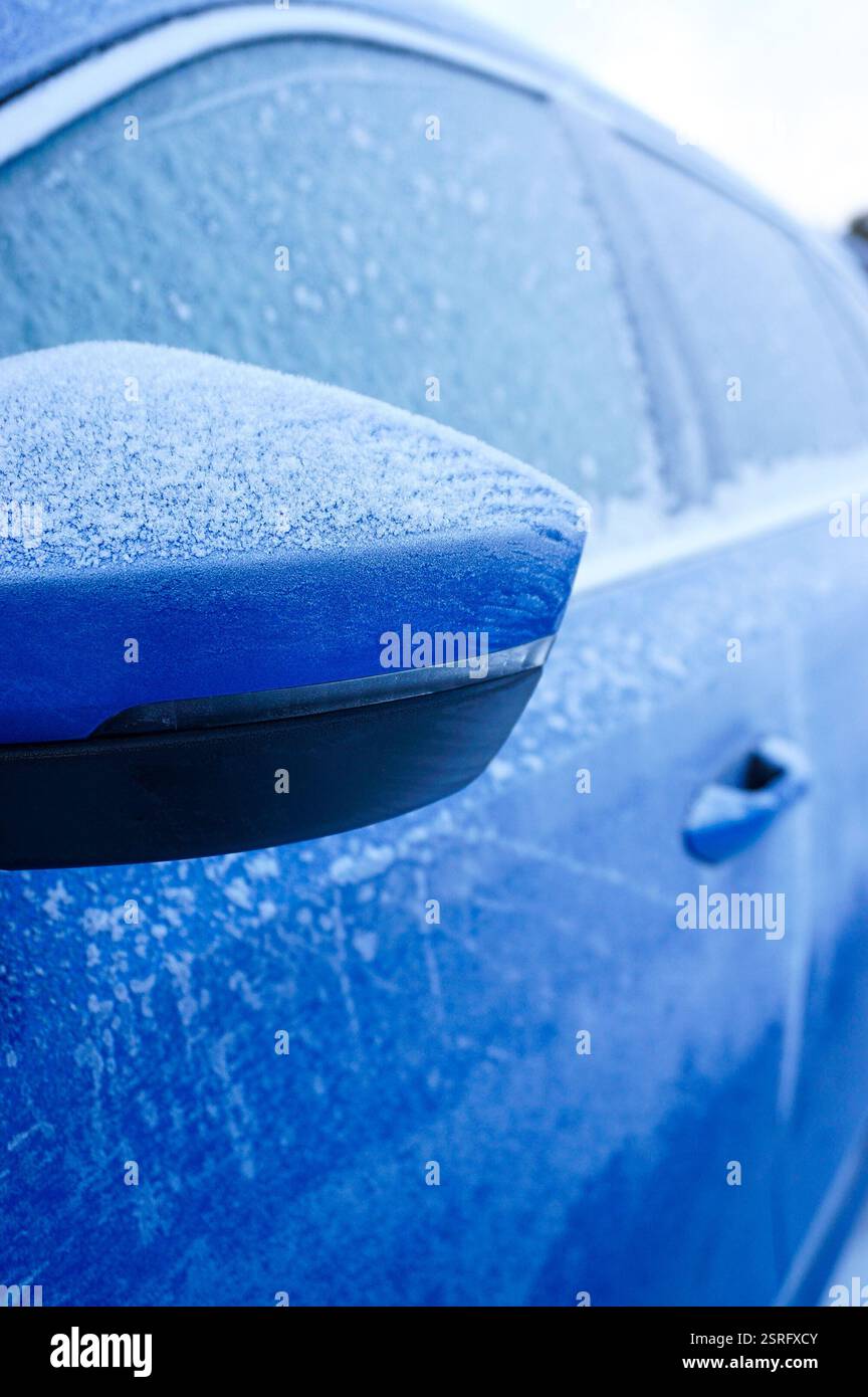 Frozen blue car Stock Photo - Alamy