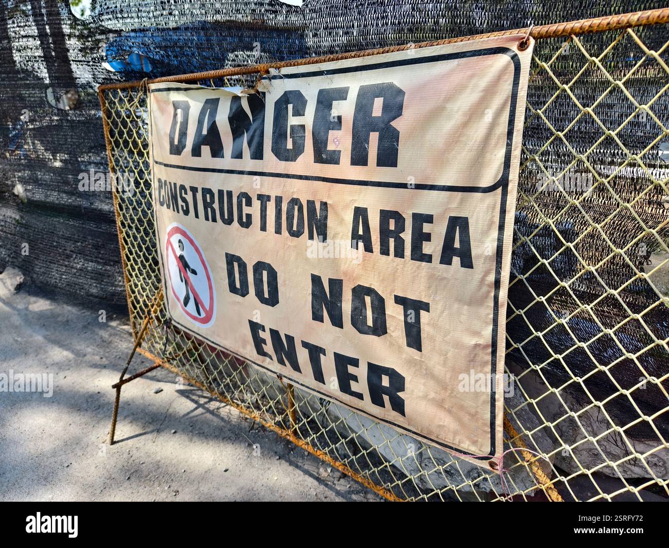 There is a noticeable sign warning of danger in front of the entrance ...